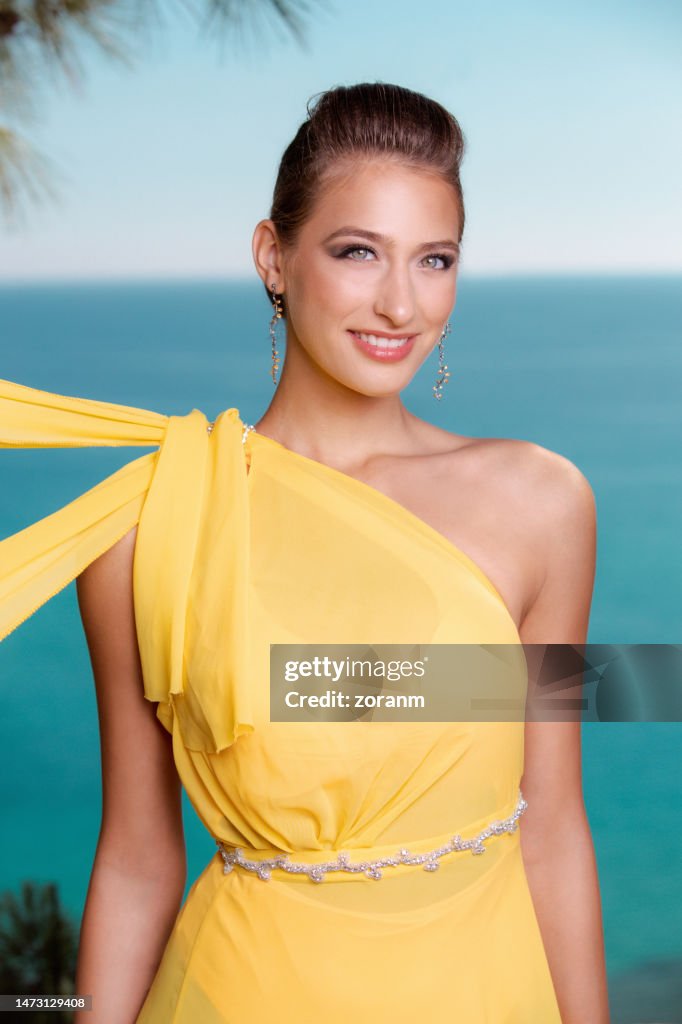 Portrait Of Beautiful Young Woman In Yellow Dress Off Shoulder And