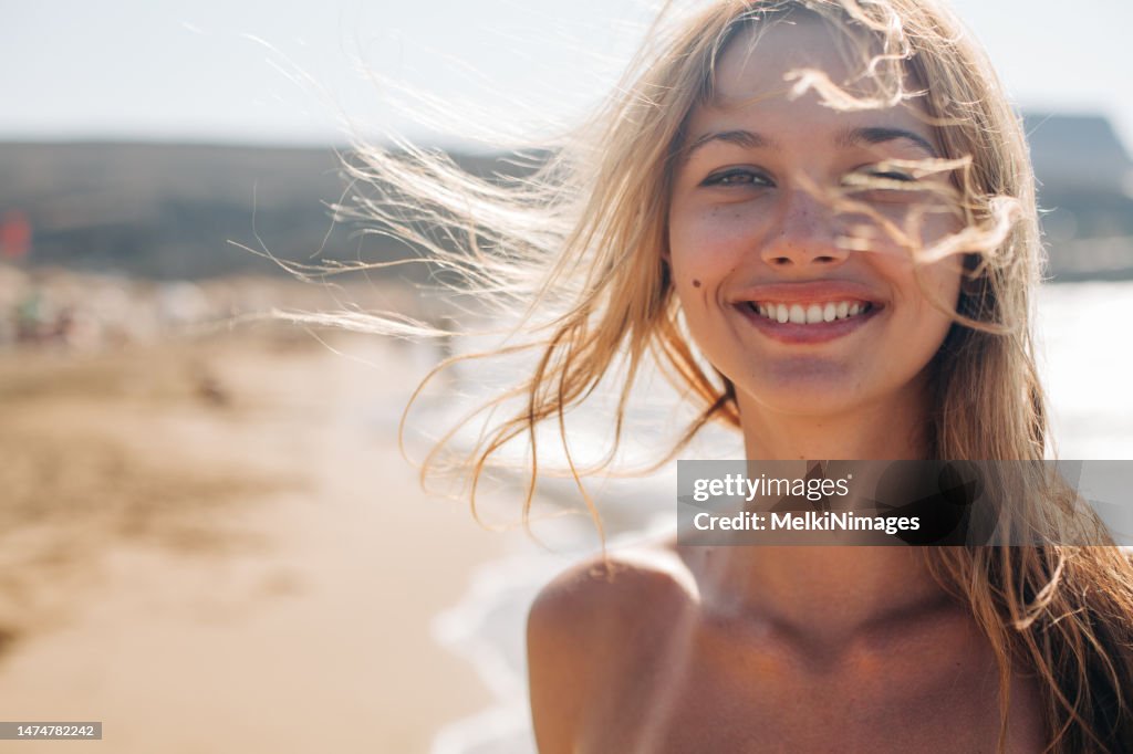 Wind Blowing Hair Of A Beautiful Woman On The Beach High Res Stock