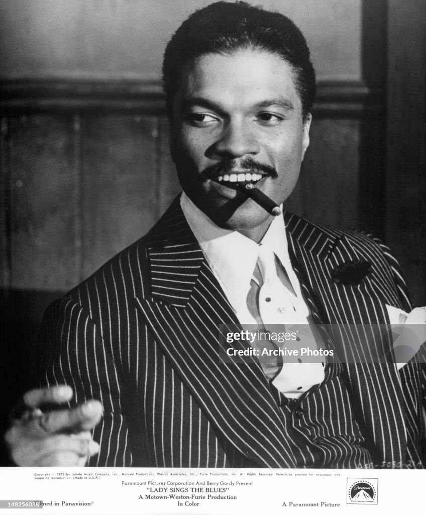 Billy Dee Williams In A Striped Suit With A Cigar In His Mouth In A