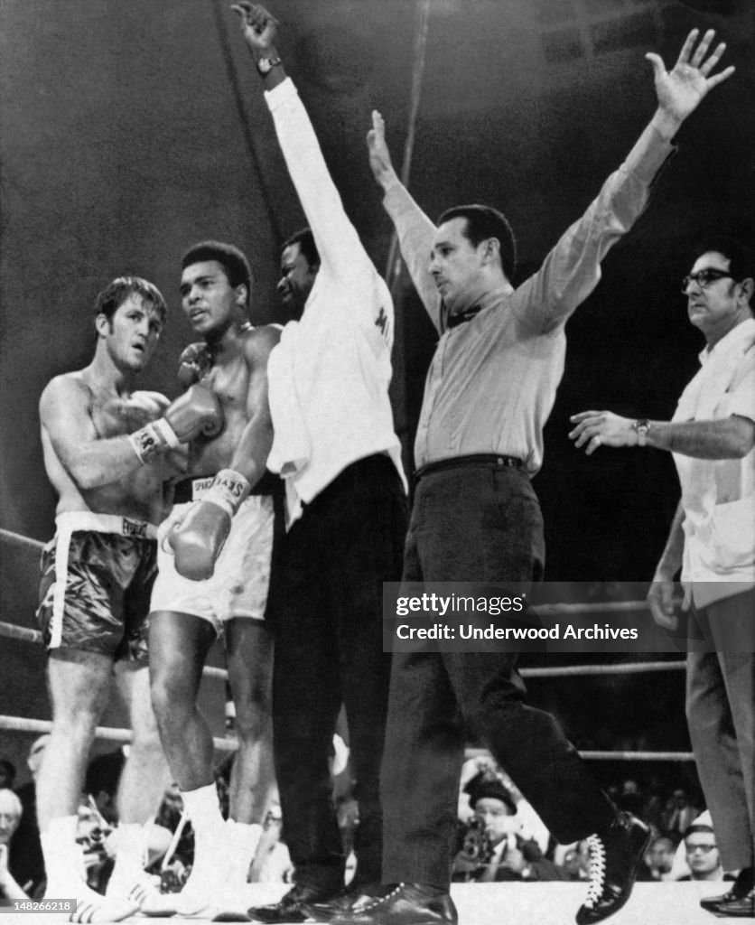 Referee Tony Perez Signals The End Of The Fight Between Muhammad Ali