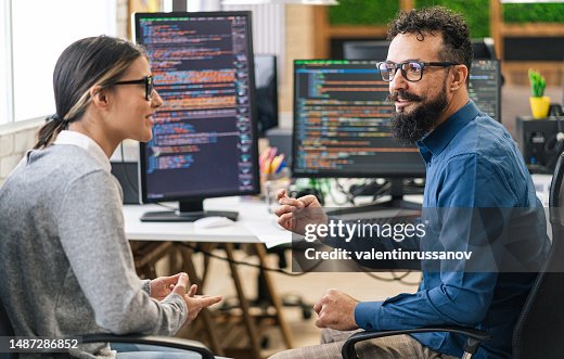 Software Programmers Analyzing Html Code And Database Brainstorming ... Software Programmers Analyzing Html Code And Database Brainstorming ...