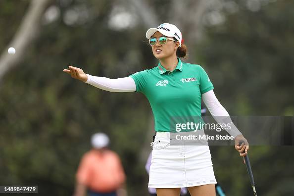 Minjee Lee Of Australia Throws A Ball To Her Caddie On The Seventh