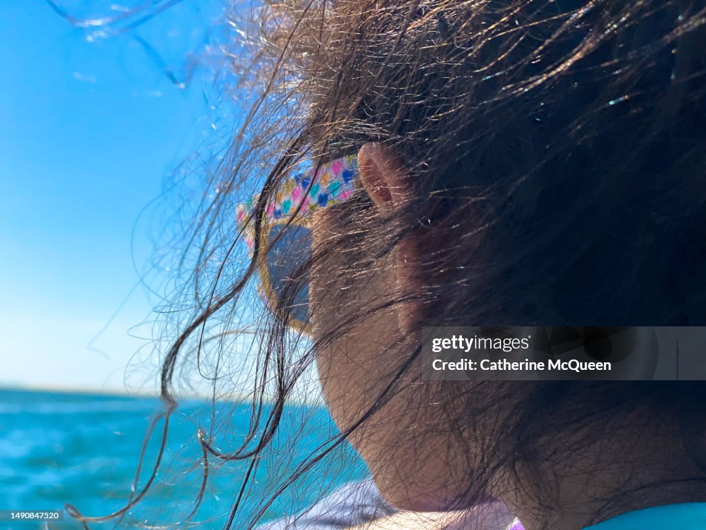 Young Mixedrace Girl Enjoys View Of The Sea From Boat Photo Getty Images