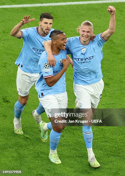 Manuel Akanji Celebrates With Erling Haaland Of Manchester City After
