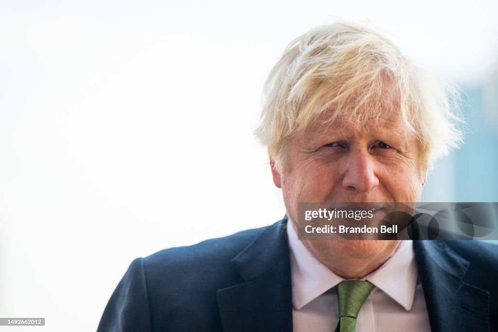 Former UK Prime Minister Boris Johnson looks on during a tour after a ... Former UK Prime Minister Boris Johnson looks on during a tour after a ...