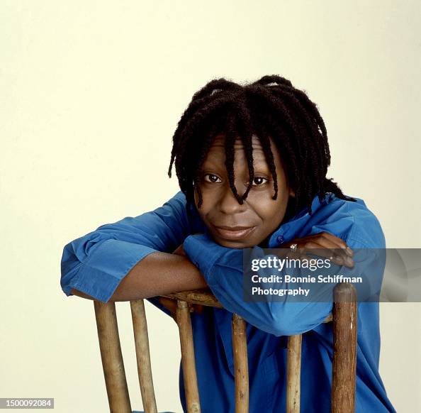 American Actress Whoopi Goldberg Poses For A Portrait Sitting In A