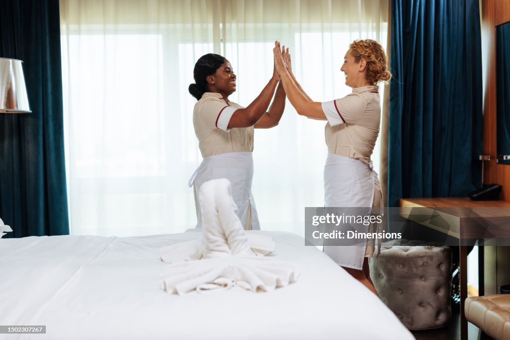 Caucasian And Africanamerican Hotel Maids Happy After Successfully