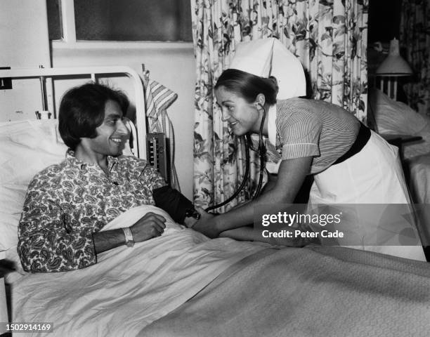 Caring Nurse With Patient Photos And Premium High Res Pictures Getty