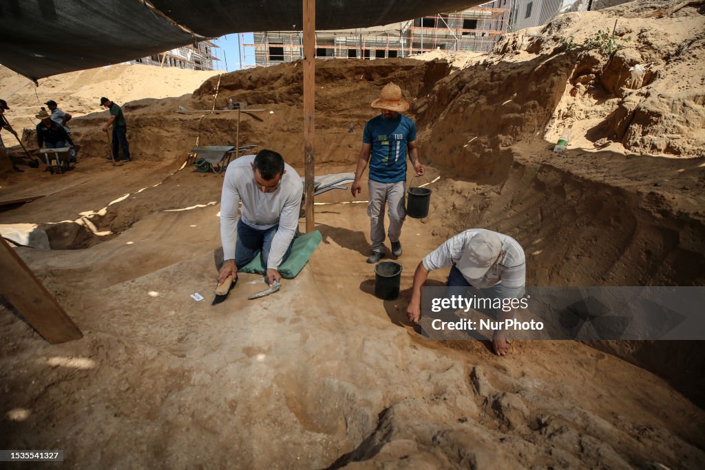 A Member Of A Palestinian Excavation Team Working At A Roman Era