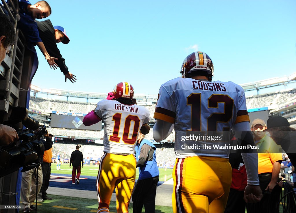 Washington Redskins quarterbacks Robert Griffin III and Kirk Cousins ... Washington Redskins quarterbacks Robert Griffin III and Kirk Cousins ...