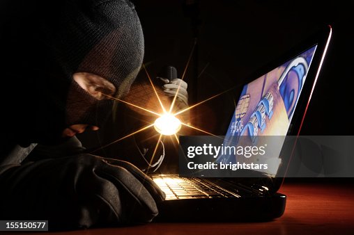Thief Accessing A Laptop High-Res Stock Photo - Getty Images Thief Accessing A Laptop High-Res Stock Photo - Getty Images