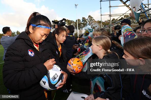Captain Huynh Nhu Of Vietnam Signs Autographs For Fans During A News