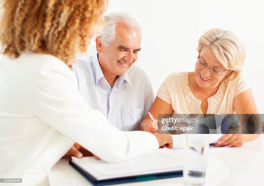 Senior Couple Meeting With Financial Advisor High-Res Stock Photo ... Senior Couple Meeting With Financial Advisor High-Res Stock Photo ...
