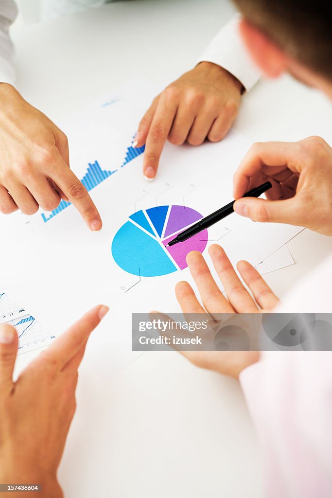Business Team Reviewing Charts Together High-Res Stock Photo - Getty Images Business Team Reviewing Charts Together High-Res Stock Photo - Getty Images