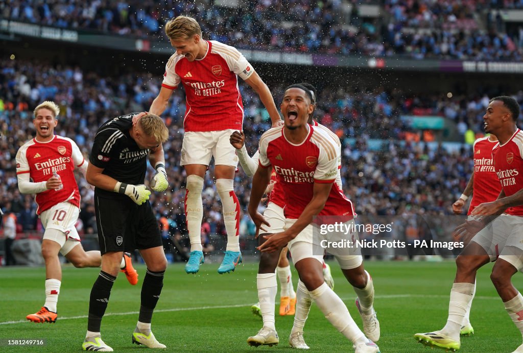 Left to right, Arsenal's Aaron Ramsdale, Martin Odegaard, William ... Left to right, Arsenal's Aaron Ramsdale, Martin Odegaard, William ...