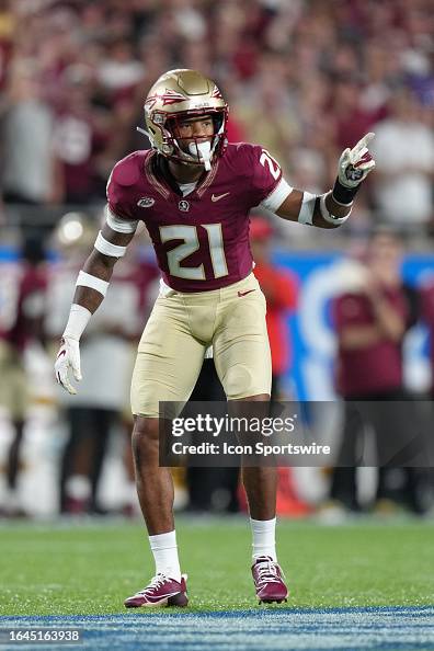 Florida State Seminoles defensive back Greedy Vance Jr. signals to a ... Florida State Seminoles defensive back Greedy Vance Jr. signals to a ...