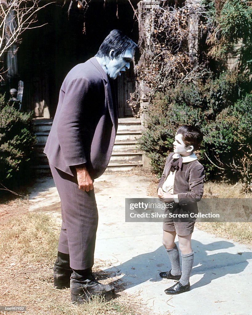 American Actors Fred Gwynne As Herman Munster And Butch Patrick As