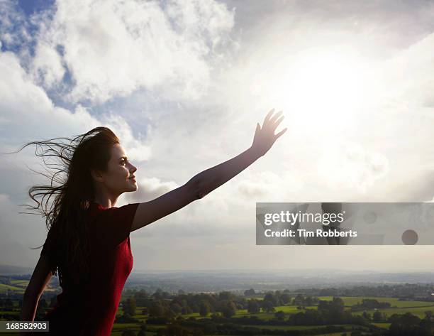 Girl Reaching Up To The Sky