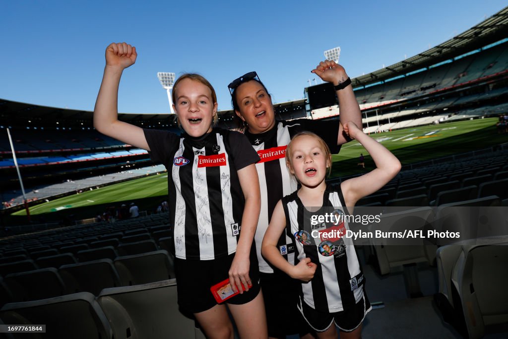 Collingwood Fans Pose For A Photo During The 2023 Afl Grand Final