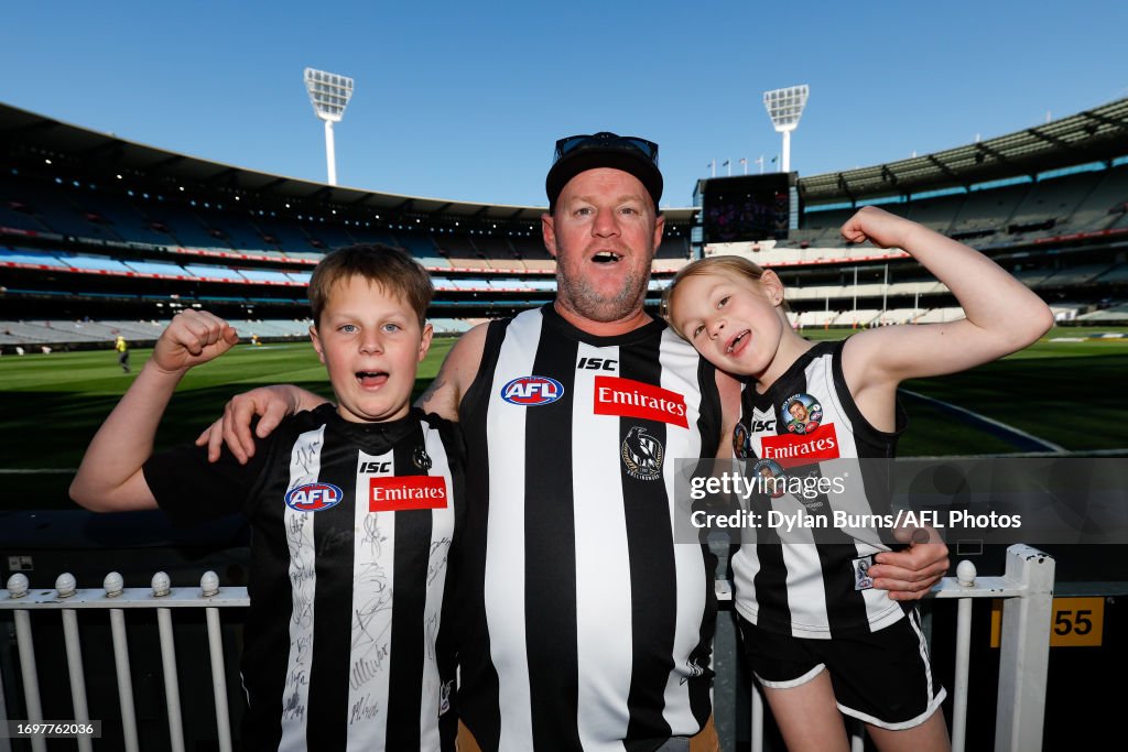 Collingwood Fans Pose For A Photo During The 2023 Afl Grand Final