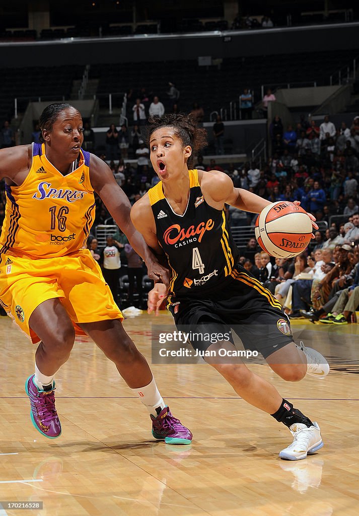 Skylar Diggins Of The Tulsa Shock Drives Against Ebony Hoffman Of The