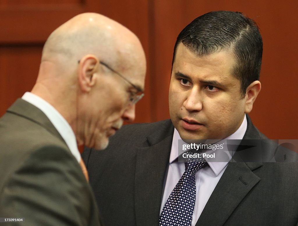 George Zimmerman Speaks With His Defense Counsel Don West As They