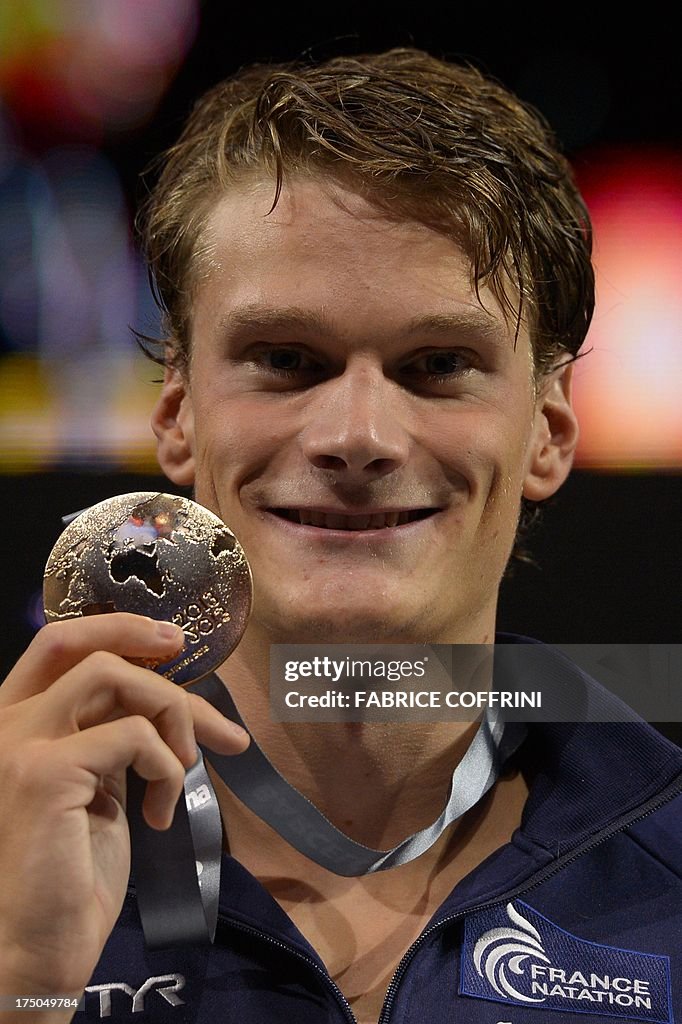 Gold Medalist Frances Yannick Agnel Poses On The Podium With His