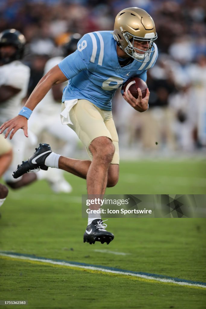 Bruins quarterback Collin Schlee runs the football during the college ... Bruins quarterback Collin Schlee runs the football during the college ...