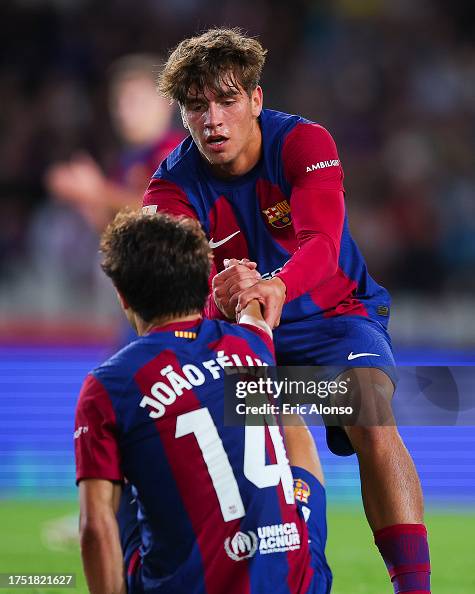Marc Guiu of FC Barcelona helps Joao Felix of FC Barcelona during the ... Marc Guiu of FC Barcelona helps Joao Felix of FC Barcelona during the ...