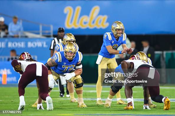 Bruins quarterback Collin Schlee awaits the snap during the college ... Bruins quarterback Collin Schlee awaits the snap during the college ...