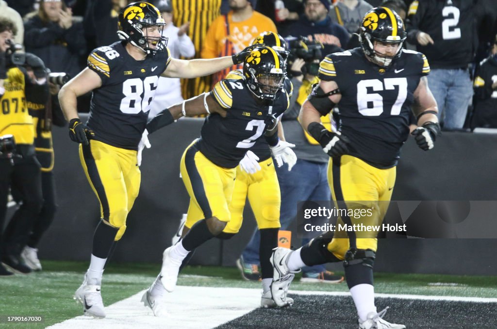 Running back Kaleb Johnson of the Iowa Hawkeyes celebrates a... News ... Running back Kaleb Johnson of the Iowa Hawkeyes celebrates a... News ...