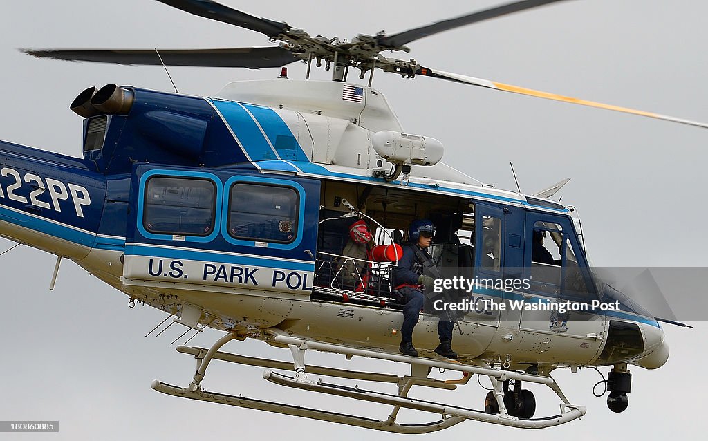 Park Police Helicopter Carrying A Sharp Shooter In It Open Door Way