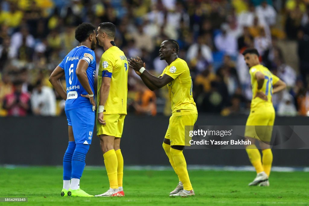 Ali Al Buliahi Of Al Hilal And Cristiano Ronaldo Of Al Nassr Fight
