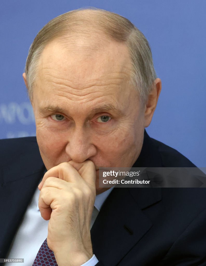 Russian President Vladimir Putin Reacts During A Meeting With Local