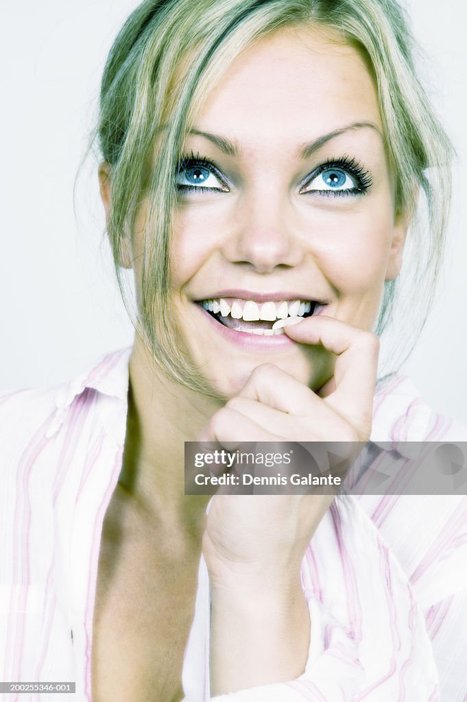 Young Woman Biting Fingernail High-Res Stock Photo - Getty Images Young Woman Biting Fingernail High-Res Stock Photo - Getty Images