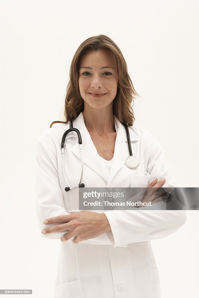 Young Female Doctor Standing With Arms Crossed Smiling Portrait High