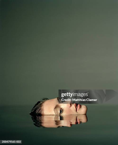 Woman Looking At Reflection In Water Photos And Premium High Res
