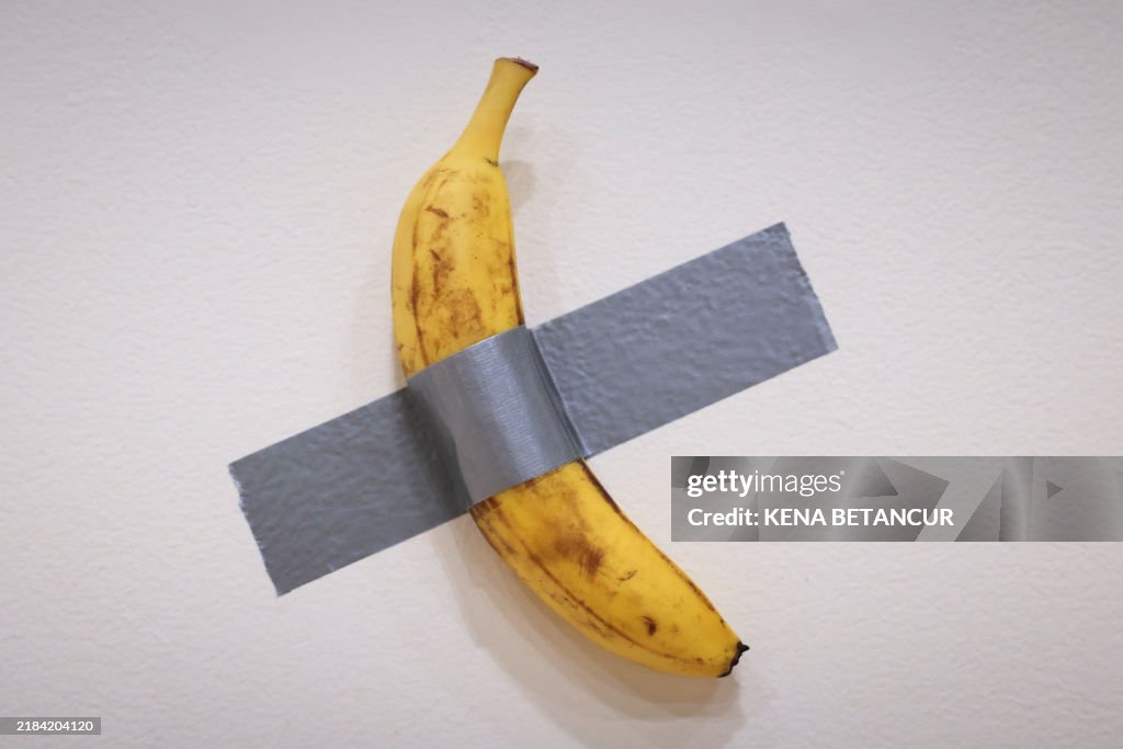 Italian visual artist Maurizio Cattelan's duct-taped Banana entitled ... Italian visual artist Maurizio Cattelan's duct-taped Banana entitled ...