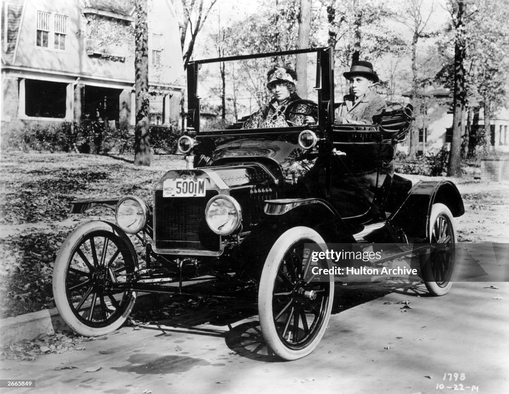 A Ford Model T Couplet Convertible Car With A Couple Sitting In It News Photo Getty Images