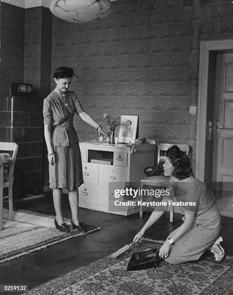 A British Woman In Her Berlin Flat Directs Her German Maid On News