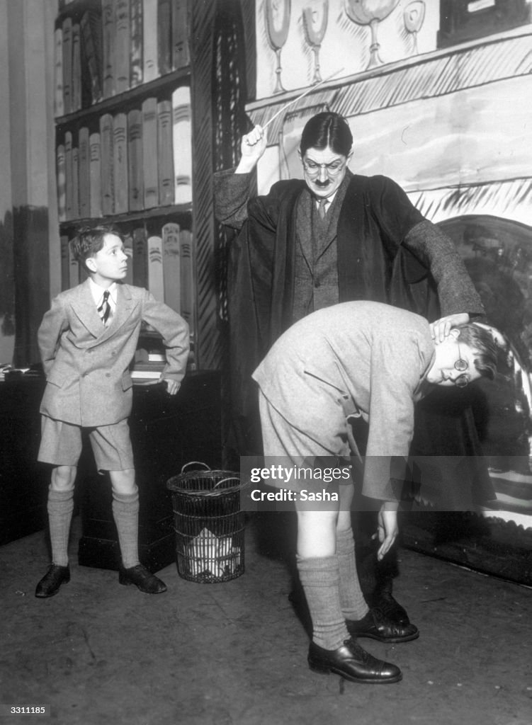 A Teacher Canes A Pupil In A Scene From The Play What Happened To News Photo Getty Images