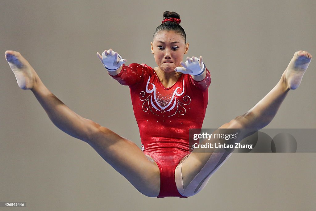 Kyla Ross Of The United States Performs On The Uneven Bars During The