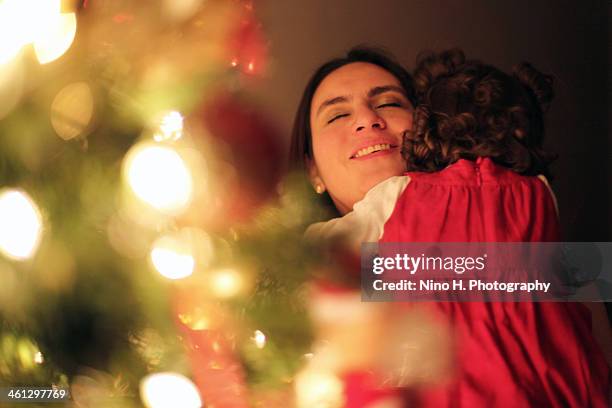 Mother Daughter Christmas Hug Photos And Premium High Res Pictures