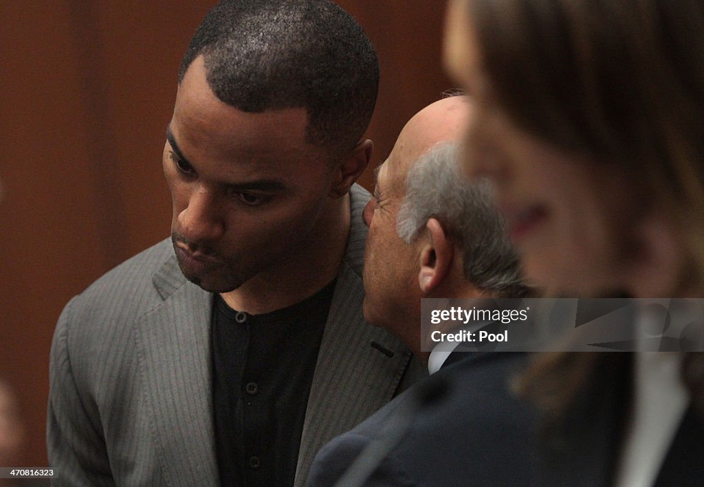 Former NFL safety Darren Sharper, left, huddles with one of his... News ... Former NFL safety Darren Sharper, left, huddles with one of his... News ...