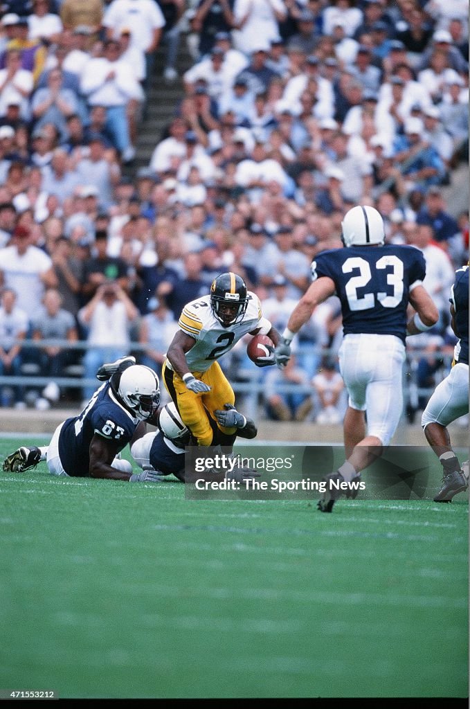 Fred Russell Of The Iowa Hawkeyes Runs With The Ball Against The Penn