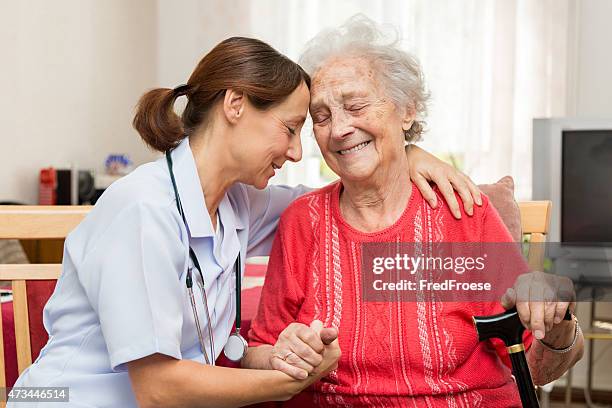 Senior Patient Hugging Doctor Photos And Premium High Res Pictures