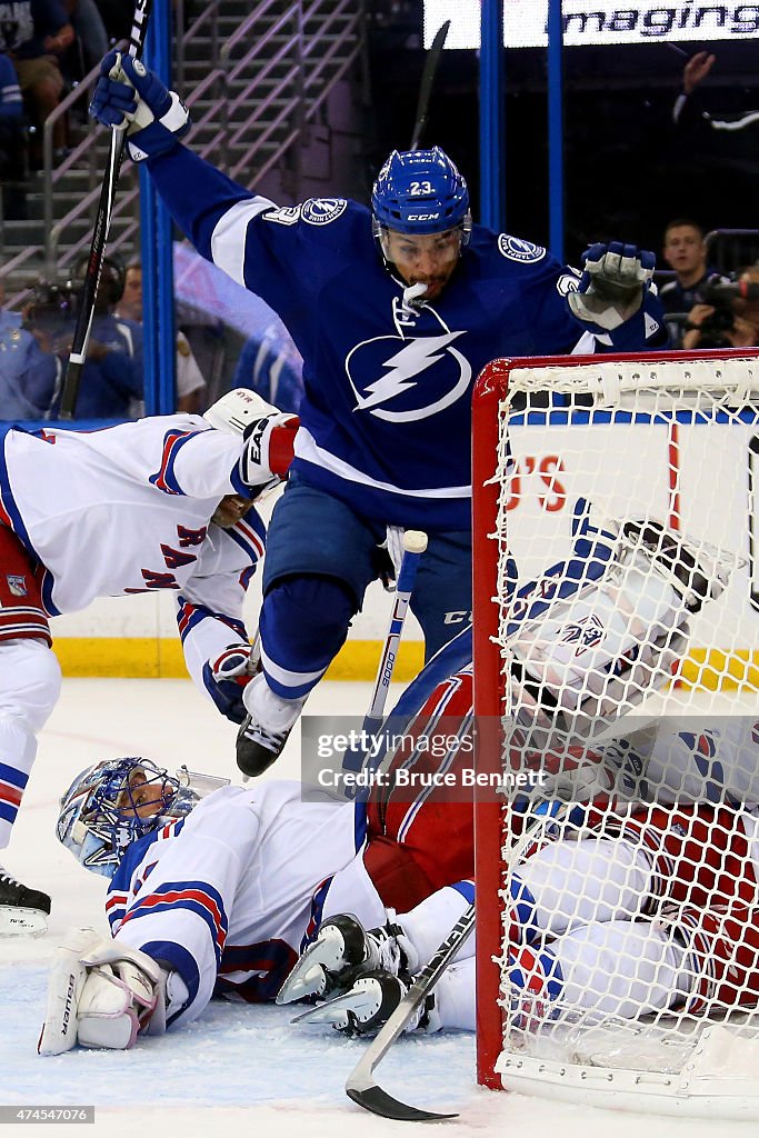 J T Brown Of The Tampa Bay Lightning Trips Over Henrik Lundqvist Of