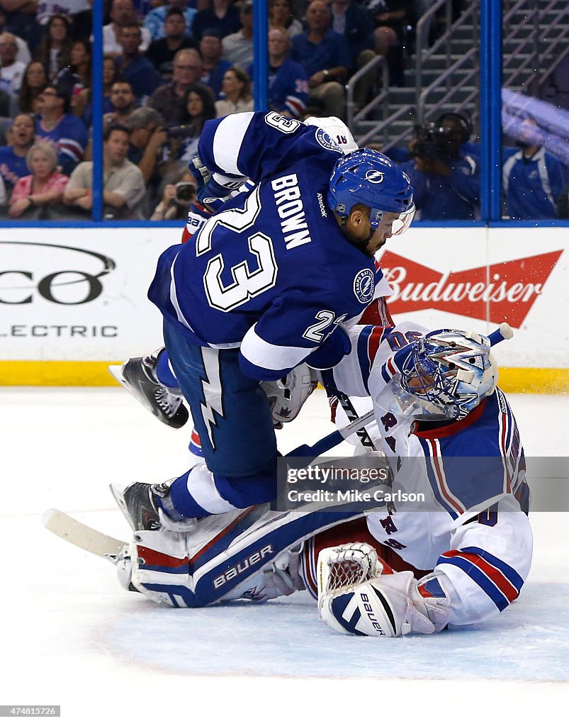 J T Brown Of The Tampa Bay Lightning Collides With Henrik Lundqvist