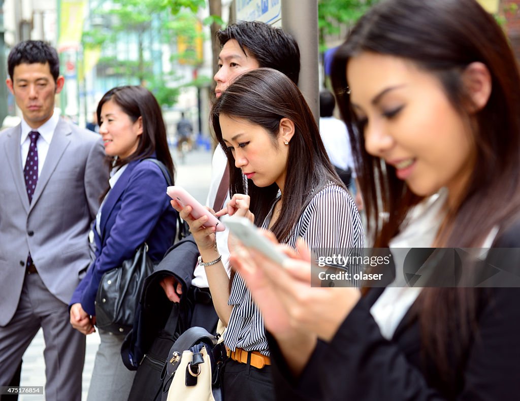 People Waiting Using Their Smart Phones High-Res Stock Photo - Getty Images People Waiting Using Their Smart Phones High-Res Stock Photo - Getty Images
