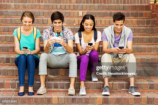 Group Of Teens Texting Photos and Premium High Res Pictures - Getty Images Group Of Teens Texting Photos and Premium High Res Pictures - Getty Images